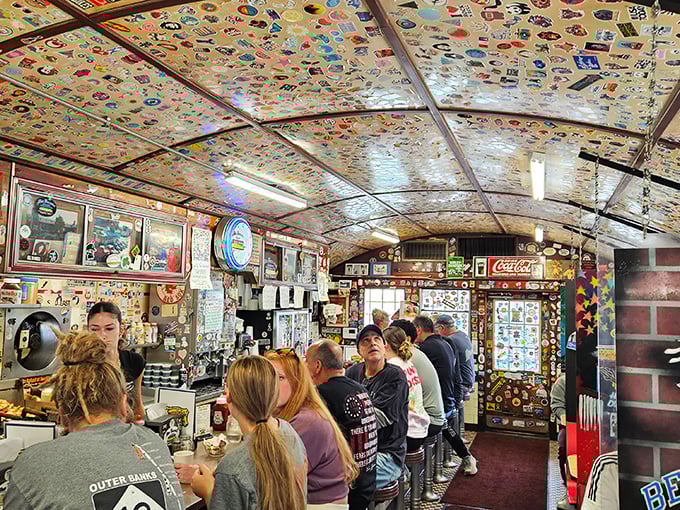 The ceiling's dollar bill collection tells thousands of stories while patrons below create new ones, fueled by coffee and community in equal measure.