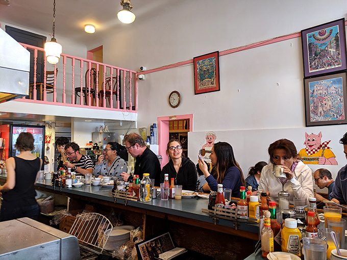 Where locals and tourists unite in the democracy of hunger. The pink railings add a touch of whimsy to serious eating business.