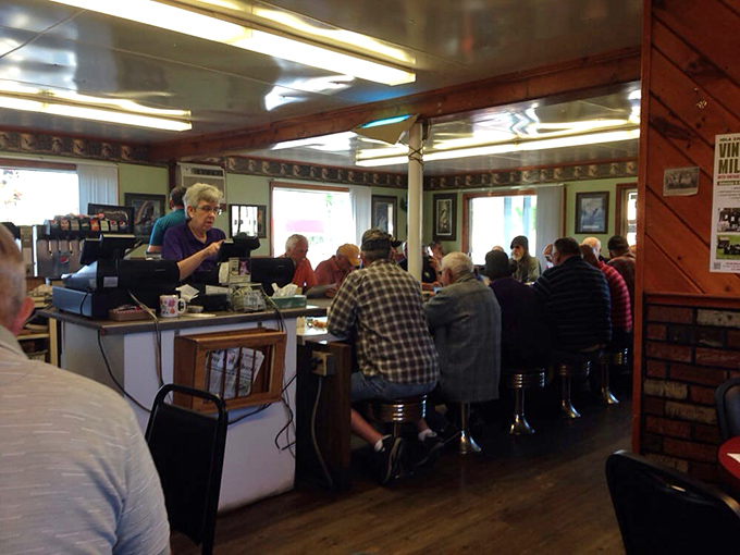 The counter where regulars have claimed their spots for decades, solving the world's problems one cup of coffee at a time.