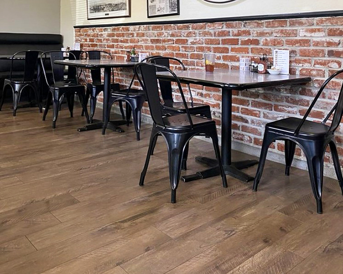 Exposed brick walls and modern seating create an atmosphere that says, "We've evolved, but we haven't forgotten what matters." Tradition meets today.