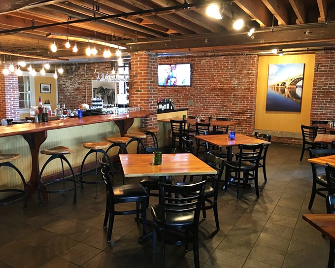 Exposed brick walls and wooden beams create a backdrop that whispers of history while the bar invites you to settle in and make new memories.