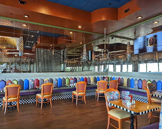 Mirrors multiply the whimsy of this dining space, where every booth feels like the best seat in the house. The checkered patterns practically dare you not to have fun.