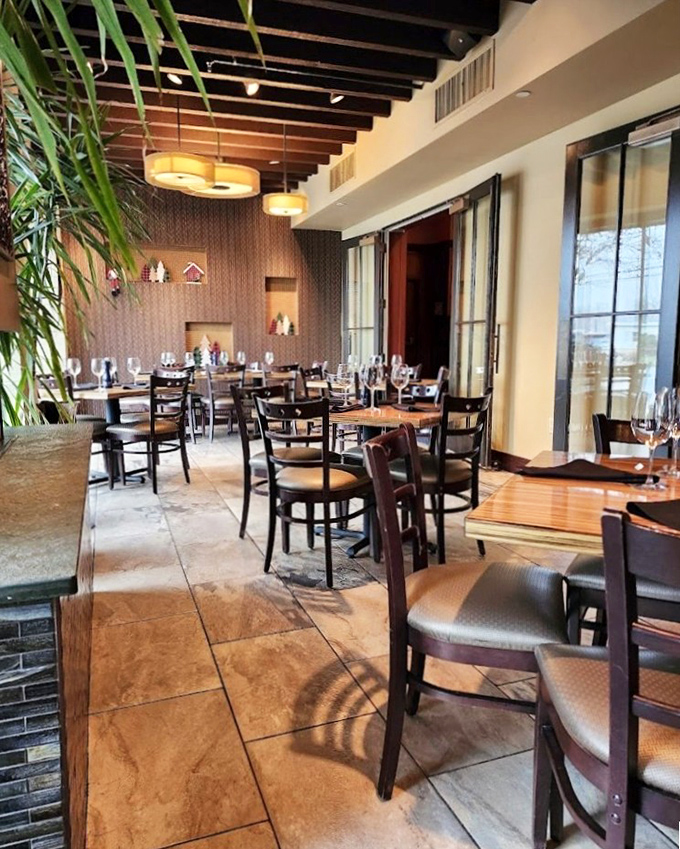 Warm woods, thoughtful spacing, and ambient lighting &ndash; a dining room that understands the importance of atmosphere.