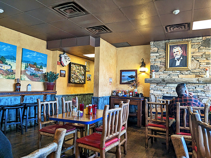 Rustic charm meets cozy comfort in this dining area where every wooden chair seems to say, "Sit down and stay awhile."