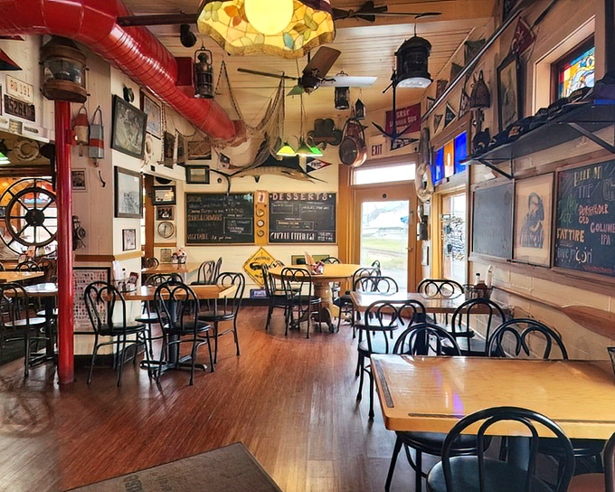 The dining room feels like the galley of a particularly stylish fishing vessel. Those stained-glass accents add a touch of unexpected elegance.