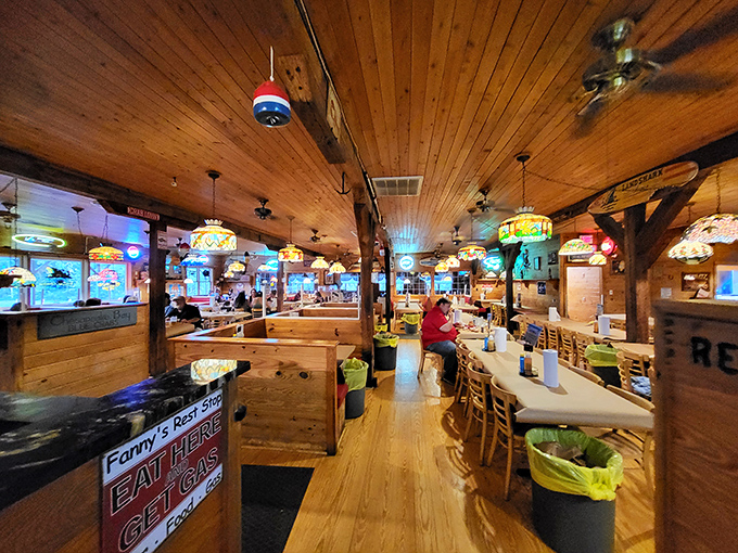 The warm glow of Tiffany-style lamps illuminates wooden booths where countless crab feasts have unfolded and seafood dreams have come true.