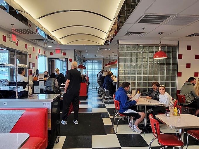 Pendant lights illuminate tables where strangers become regulars and breakfast becomes a cherished daily ritual worth protecting.