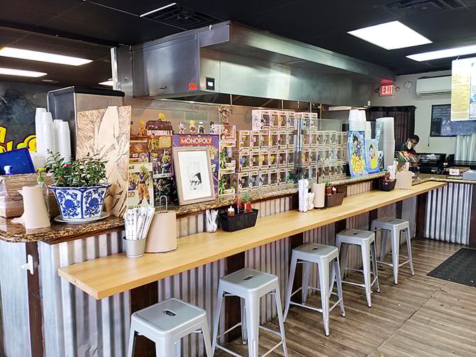 The counter isn't just for ordering&mdash;it's a museum of anime culture. Funko Pops and collectibles create a backdrop that's as entertaining as the food.