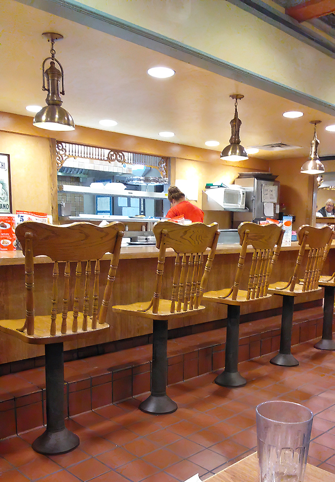 Counter seating: where solo diners become regulars and the kitchen's symphony plays out before your very eyes.