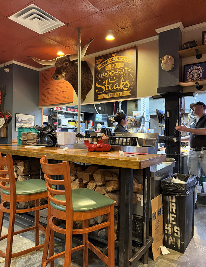 Where BBQ magic happens. That wood display isn't decorative&mdash;it's a promise of the smoky goodness infused in every bite.