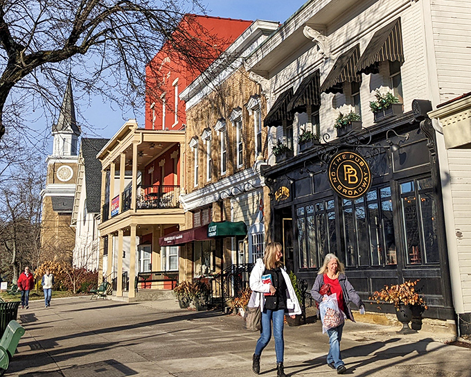 Historic storefronts stand shoulder to shoulder, their colorful facades like a welcoming committee for visitors exploring Granville's downtown treasures.