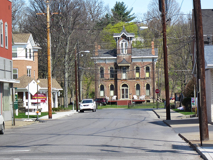 Historic buildings line quiet streets where you can practically hear echoes of conversations from decades past bouncing between brick facades.