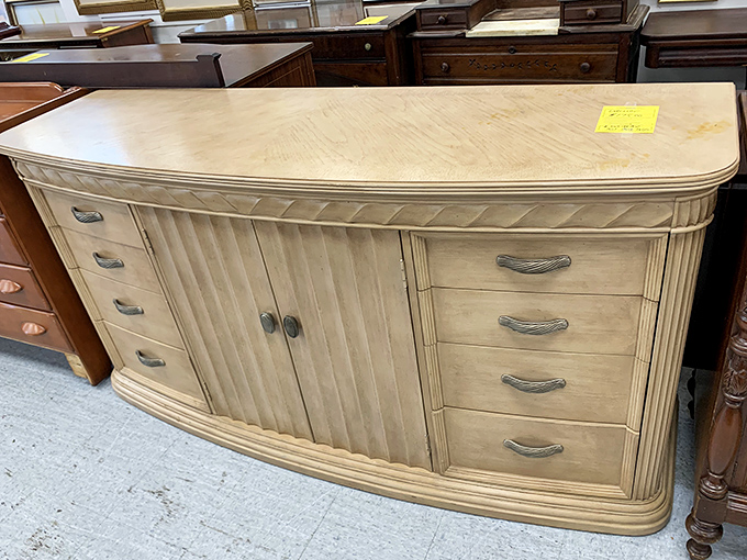 This elegant curved dresser whispers tales of bedroom suites past. Yellow tag means it's priced to find a second chapter.