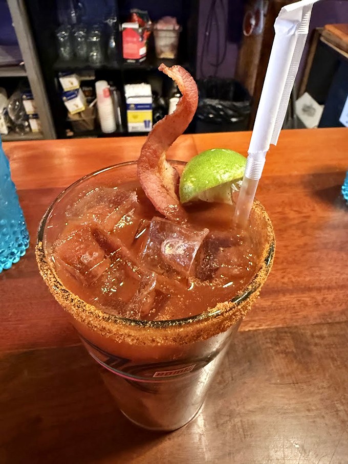A Bloody Mary garnished with bacon&mdash;because drinking vegetables counts as healthy when there's meat involved. Breakfast of champions.