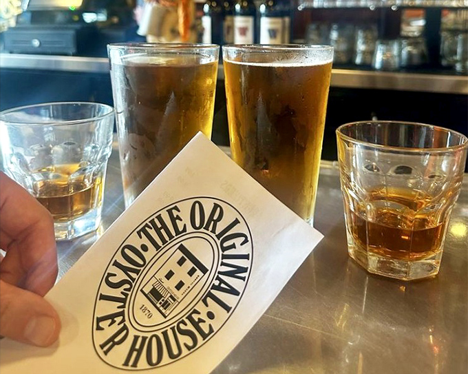 Cold beer and the Oyster House logo—a pairing as classic as fish and chips. Some traditions are worth preserving in amber.