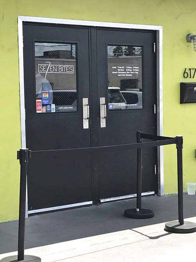 The lime-green exterior with bold black doors isn't just a restaurant entrance—it's a portal to a world where calories don't count and joy comes served on a plate.