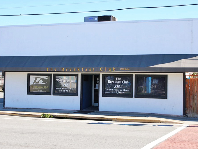 The storefront announces its purpose without pretense: "The Breakfast Club" in golden letters, a beacon for morning hunger that needs serious attention.