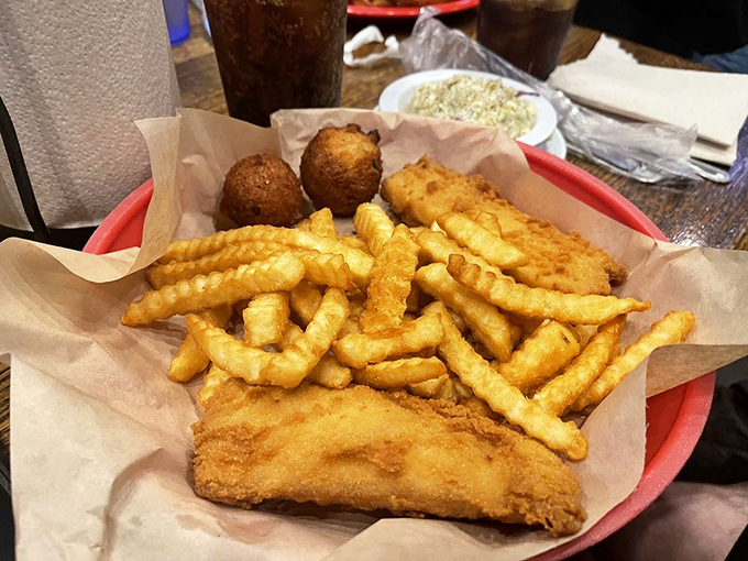 Classic fish and chips that would make a British pub proud, served on paper that catches every delicious drop of malt vinegar you might add.