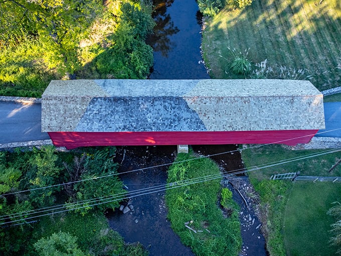 Seen from above, the bridge's roof creates a perfect line across Fishing Creek, the water flowing beneath it for generations.