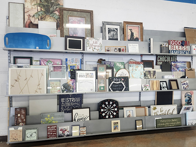 The wall of inspirational art &ndash; where "Live, Laugh, Love" meets "God Bless America" meets "CHOCOLATE" in perfect decorative harmony.