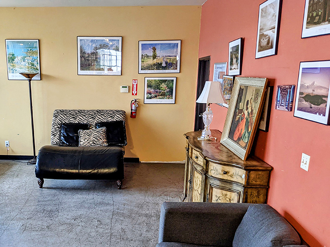 The art wall creates an impromptu gallery where framed memories and decorative pieces await adoption into new visual stories.