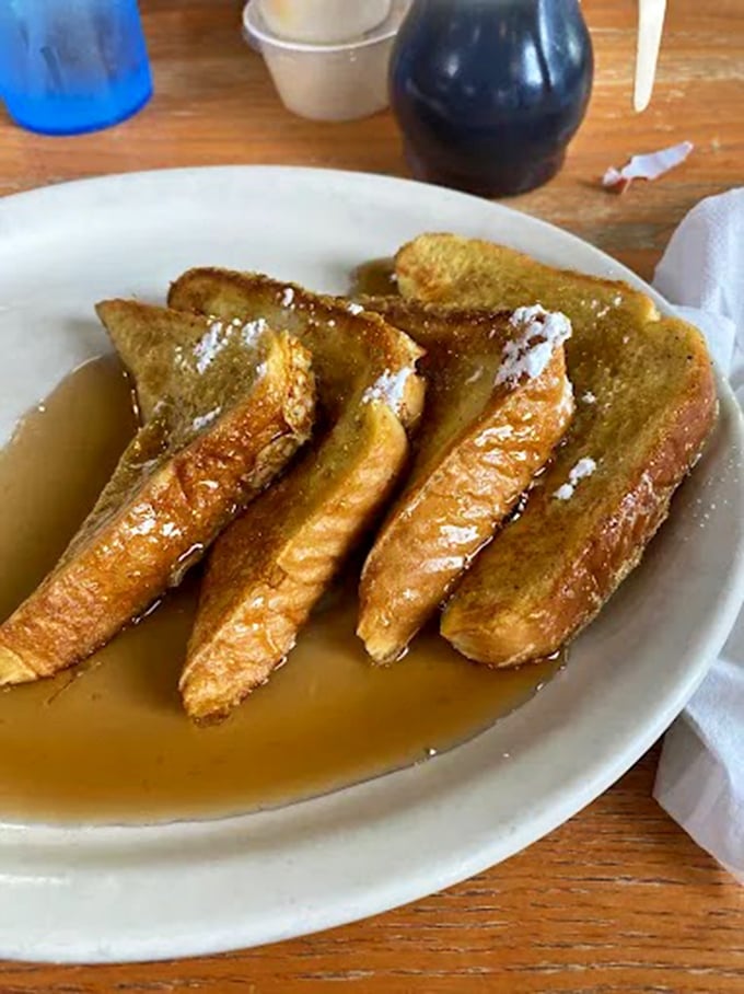French toast swimming in syrup&mdash;golden, crispy edges giving way to a custardy center. Breakfast doesn't get more comforting than this plate of morning bliss.