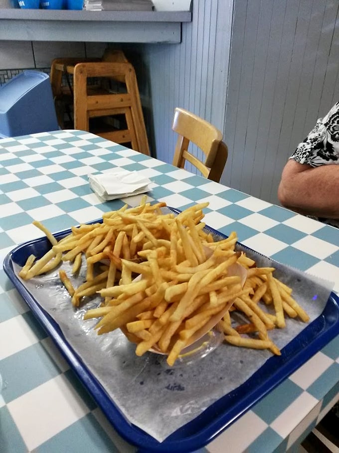 Fries piled high like a mountain of potato perfection. Crispy outside, fluffy inside&mdash;the supporting actor that often steals the show.