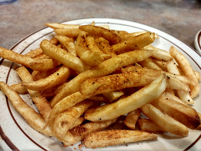 Fries seasoned with what appears to be actual flavor rather than just salt&mdash;a revolutionary concept in some establishments.