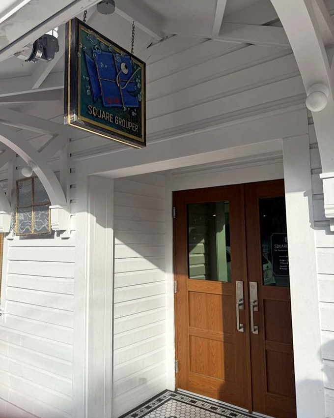 The entrance speaks volumes: unpretentious yet inviting. Behind these wooden doors awaits a culinary experience worth writing home about.