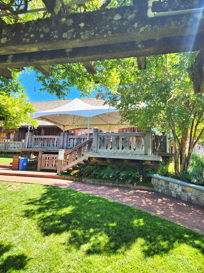 Dappled shade creates nature's air conditioning on the deck &ndash; where "outdoor seating" feels more like "vineyard-adjacent throne room."