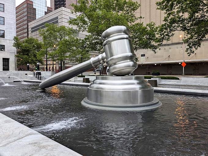 The fountain creates a moat of justice around the gavel, as if to say, "Cross this water if you dare bring frivolous lawsuits to our courts."