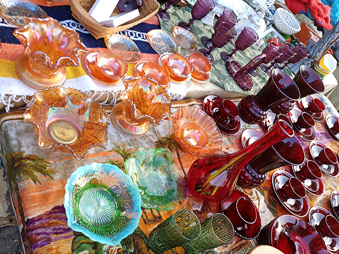 A rainbow of vintage glassware catches the light. Each piece tells a story of dinner parties past and cocktail hours waiting to happen. 