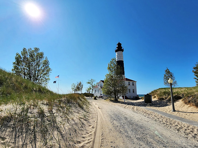The sandy approach to Big Sable feels like Michigan's version of a desert pilgrimage, with an oasis of maritime history waiting at the end.