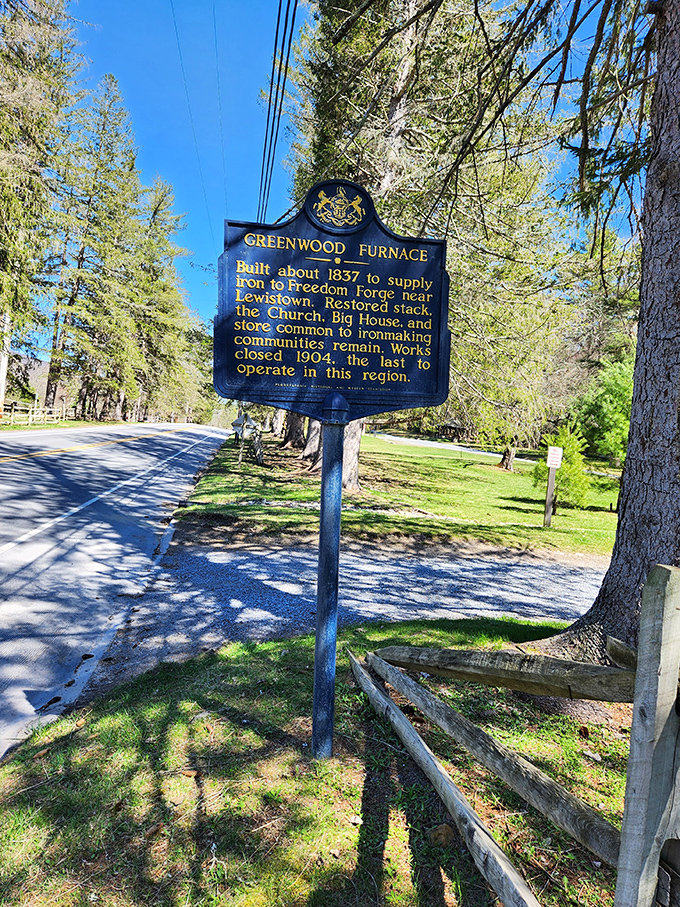 A blue and gold storyteller standing tall. This historical marker reveals Greenwood Furnace's industrial past, when iron&mdash;not recreation&mdash;was the business of the day.