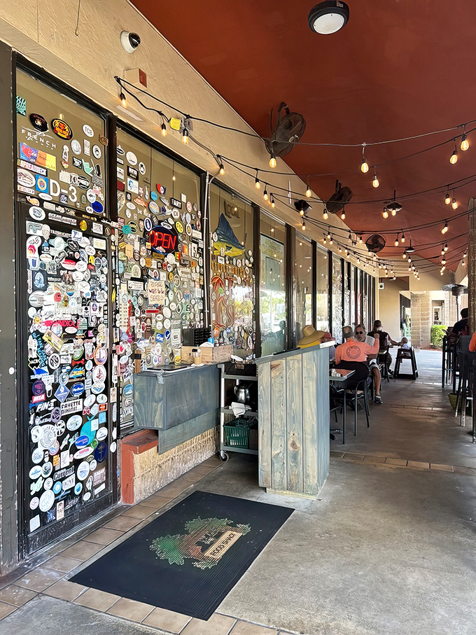 String lights and sticker stories. The outdoor seating area offers a front-row view of Jupiter life passing by while you wait for seafood nirvana.