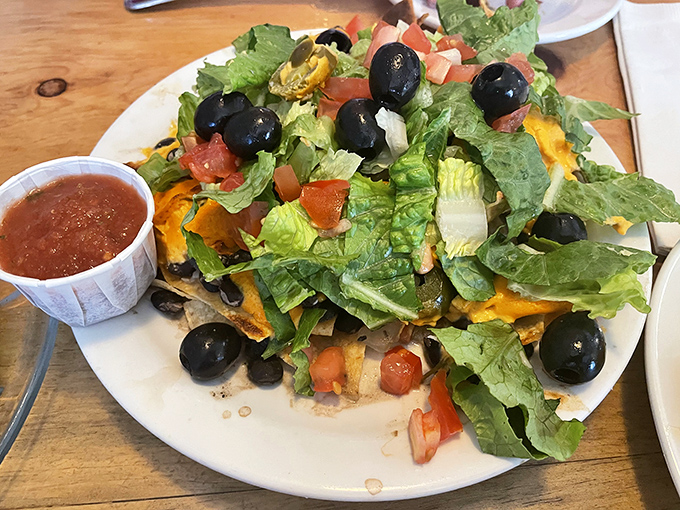 Nachos that achieve the impossible balance of fresh and indulgent—where each bite delivers the perfect ratio of crunch, cheese, and garden-fresh toppings.