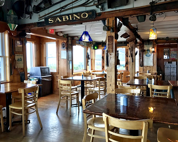 The dining room where "Sabino" sign watches over patrons like a benevolent seafaring spirit. History served alongside your meal.