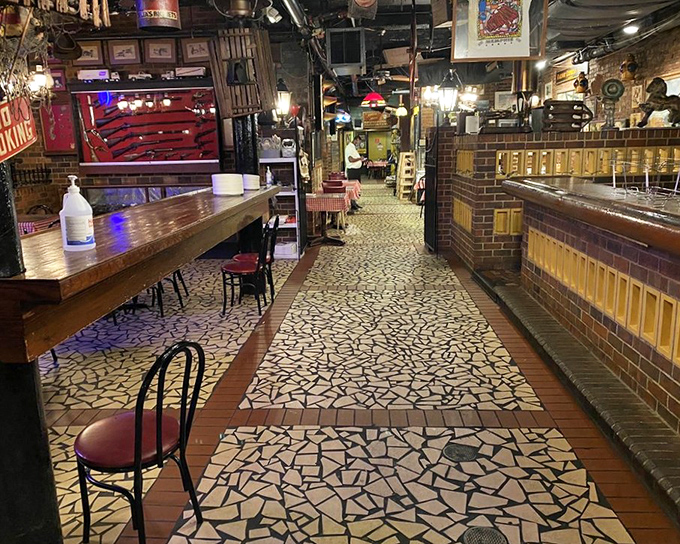 The mosaic floor and vintage bar create an atmosphere that's part barbecue joint, part museum of Memphis culture.