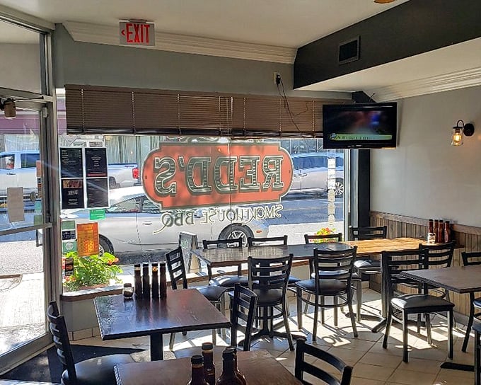 Sunlight streams in, illuminating tables where barbecue dreams come true and diet plans go to die.