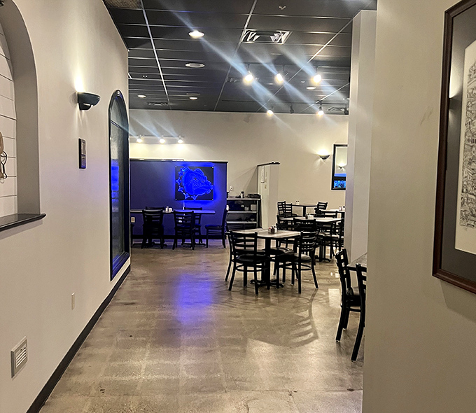 The modern dining area's clean lines and soft lighting create the perfect backdrop for the real star &ndash; whatever's on your plate.