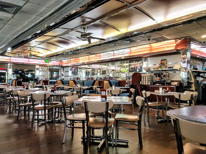 The dining room hums with conversation and the promise of comfort food, a sanctuary where calories don't count and coffee refills are infinite.