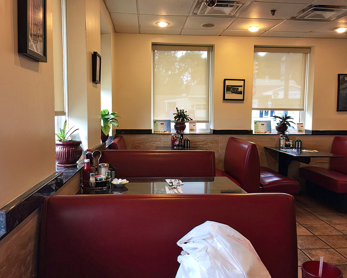 Sunlight streams through windows onto empty booths&mdash;the calm before the lunchtime storm in this neighborhood gathering place.