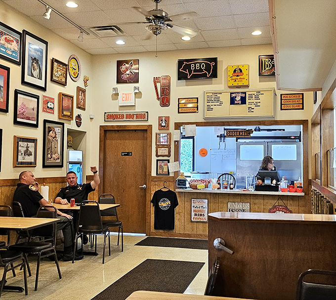 Wall-to-wall BBQ memorabilia creates an atmosphere where calories don't count and sauce stains are badges of honor.