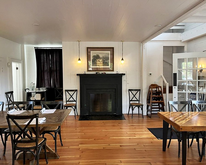 A fireplace that whispers "stay awhile" surrounded by tables that have likely witnessed countless first dates and anniversary celebrations.