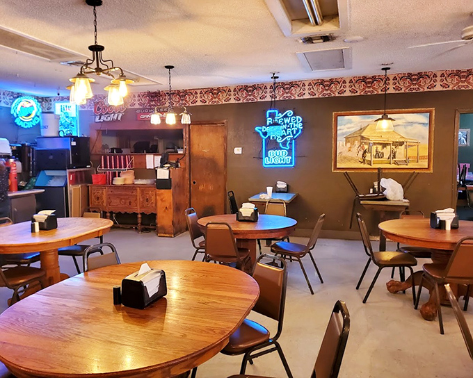 Neon signs cast a warm glow over wooden tables, creating that rare atmosphere where both your food and your soul feel equally nourished.