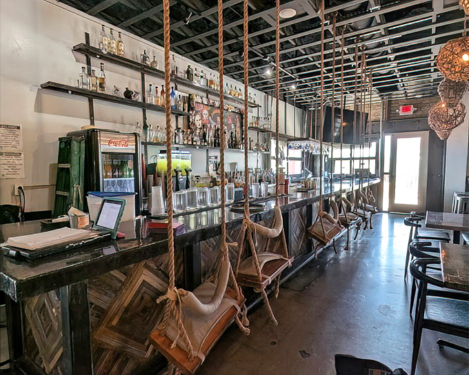 The bar area combines rustic charm with unexpected whimsy&mdash;those swing seats aren't just Instagram-worthy, they're the perfect perch for sipping margaritas between bites.