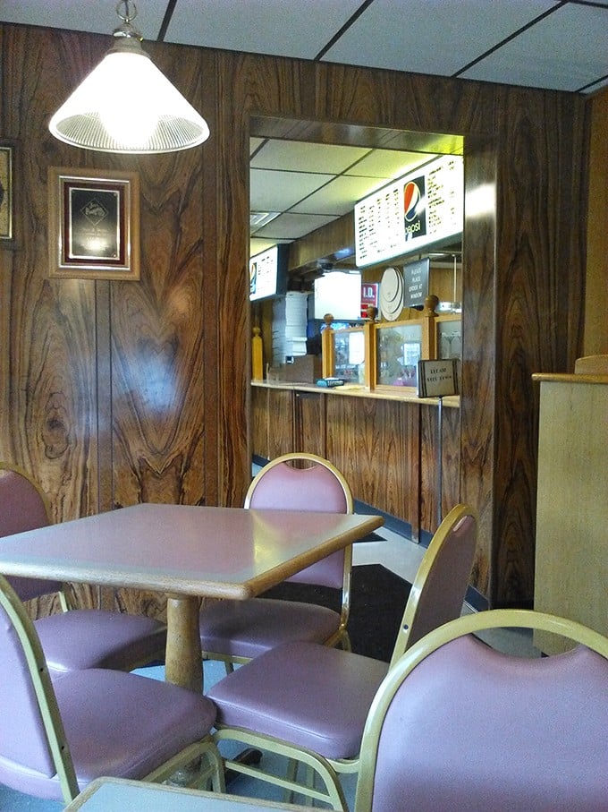 Classic pizzeria seating where generations have gathered, proving good design never really goes out of style.