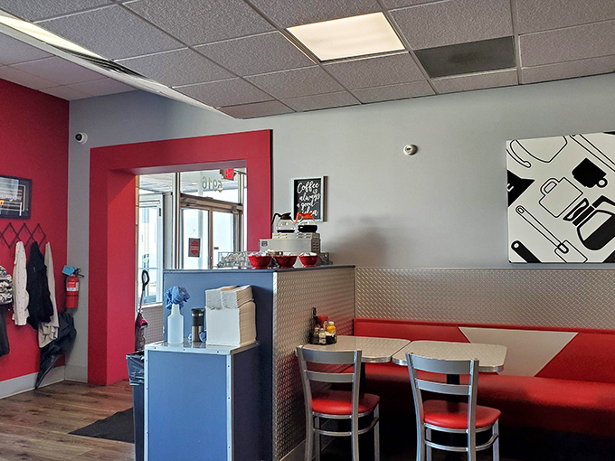 Red accents pop against cool blues in this diner's color story. The entrance says, "Yes, we take breakfast seriously, but we're fun about it."