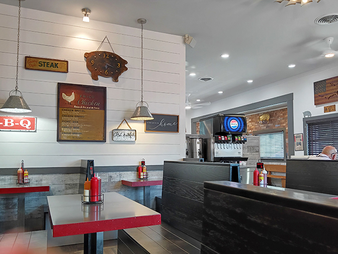 Modern touches meet classic barbecue aesthetics &ndash; white shiplap walls adorned with pig-themed d&eacute;cor, because they know exactly what they're about.