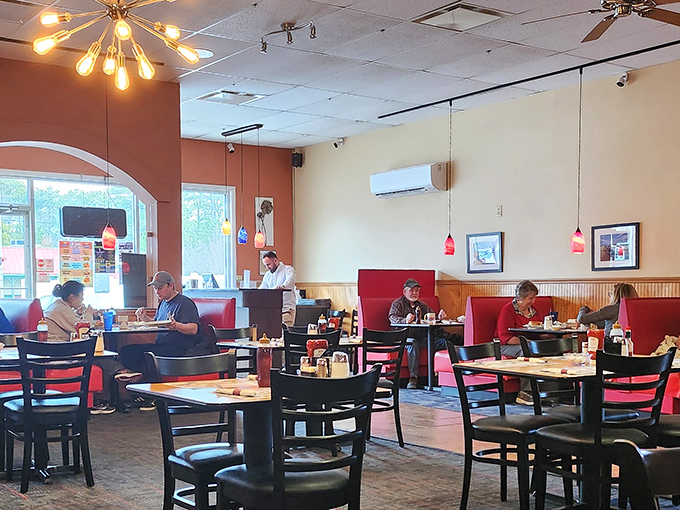Red booths and warm lighting create the perfect backdrop for morning rituals. Every table tells a different story.